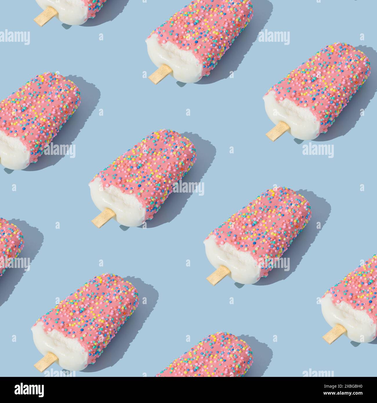 Trendy sunlight pink glazed ice cream popsicle pattern on light blue ...