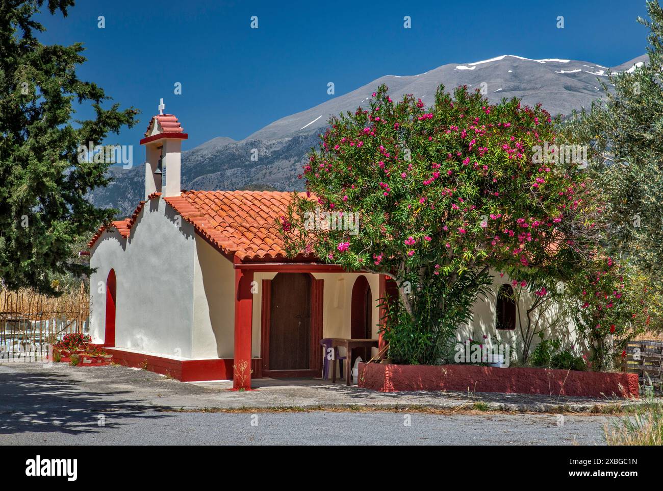 Ieros Naos (Holy Temple), village church, oleander in bloom, near town ...