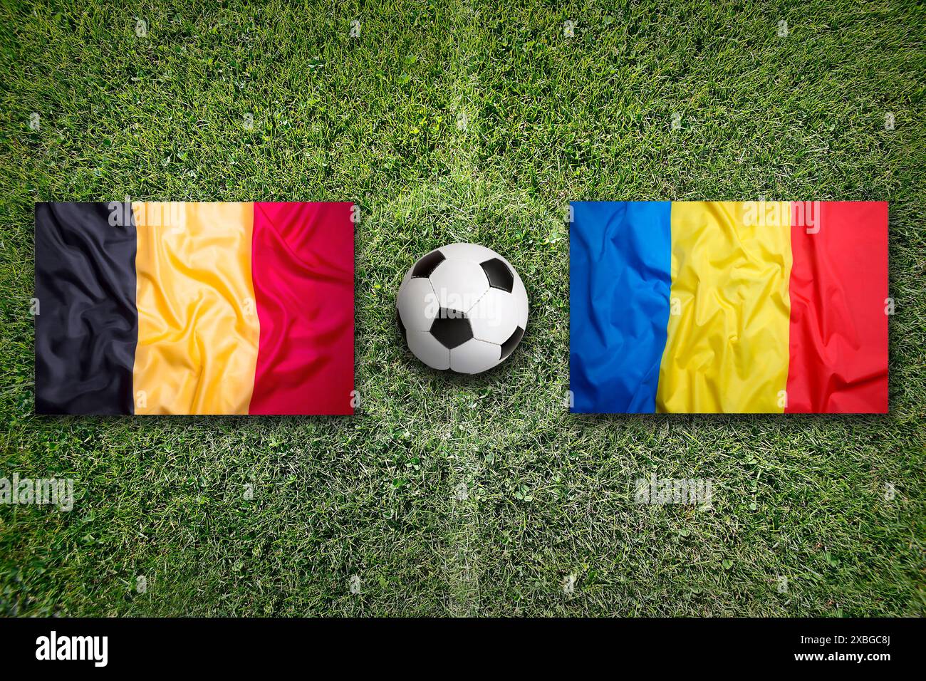 Belgium vs. Romania flags on green soccer field Stock Photo - Alamy