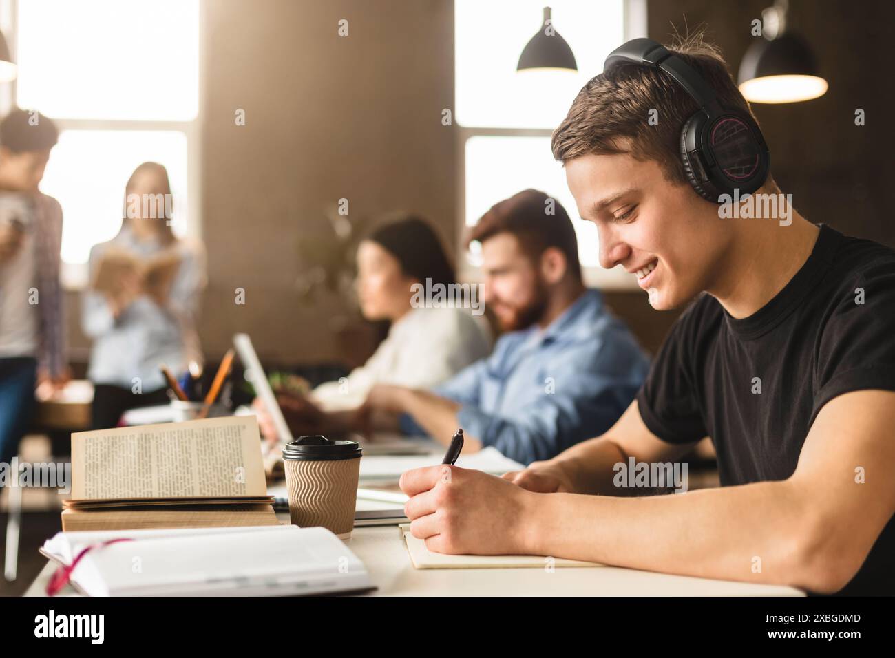 Teen taking notes table hi-res stock photography and images - Alamy