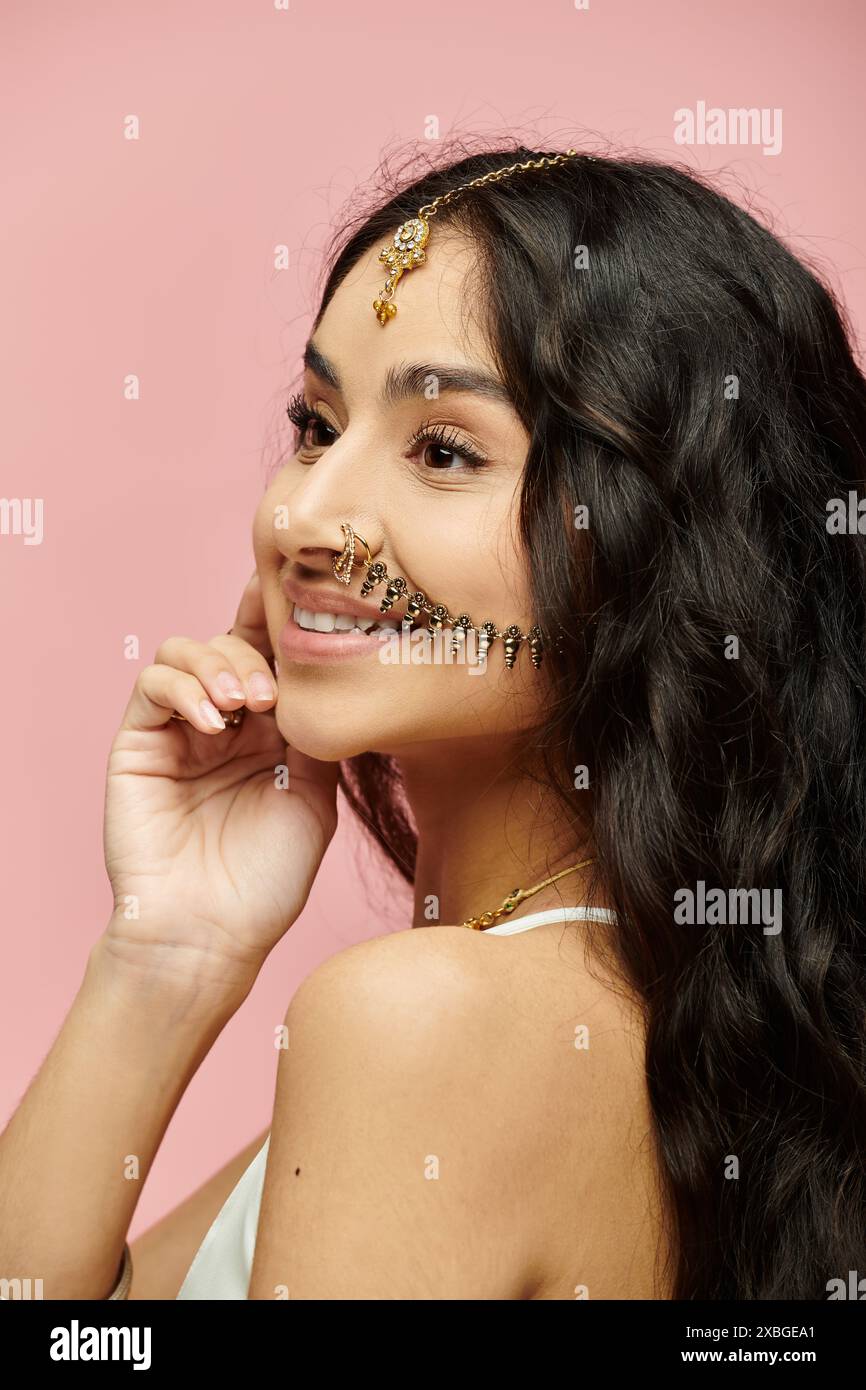 A young indian woman with flowing black hair strikes a pose Stock Photo ...
