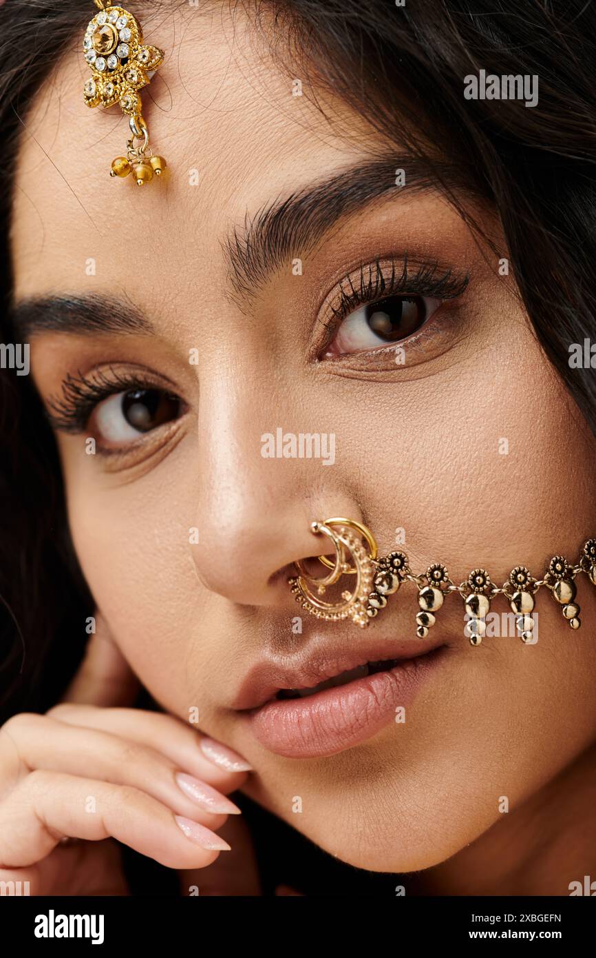 A captivating young indian woman proudly displays her intricate nose ...