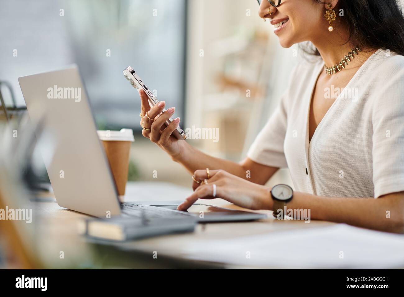 Indian woman laptop using smartphone hi-res stock photography and images - Alamy