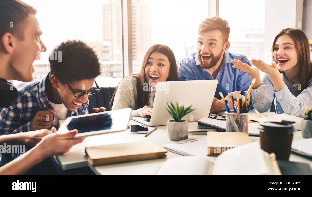 Multiethnic friends having fun, studying together for exams Stock Photo ...