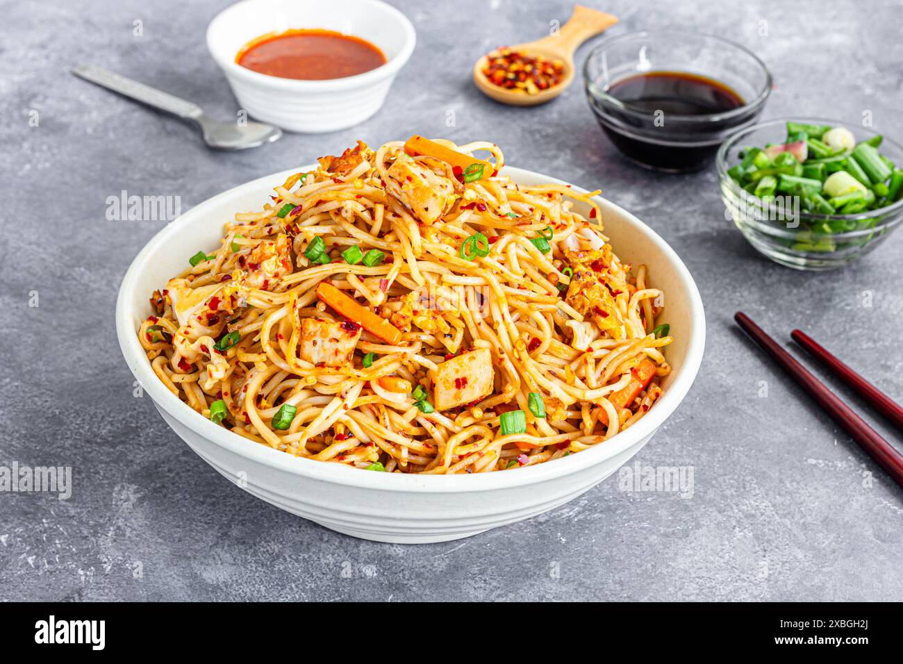 Stir-Fried Chicken and Egg Chow Mein with Condiments Stock Photo - Alamy