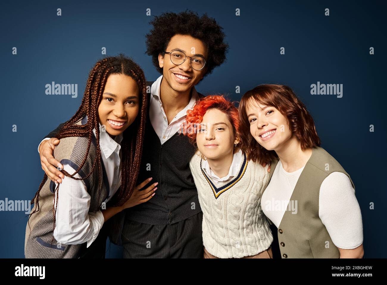 Young multicultural friends, including a nonbinary person, stand ...