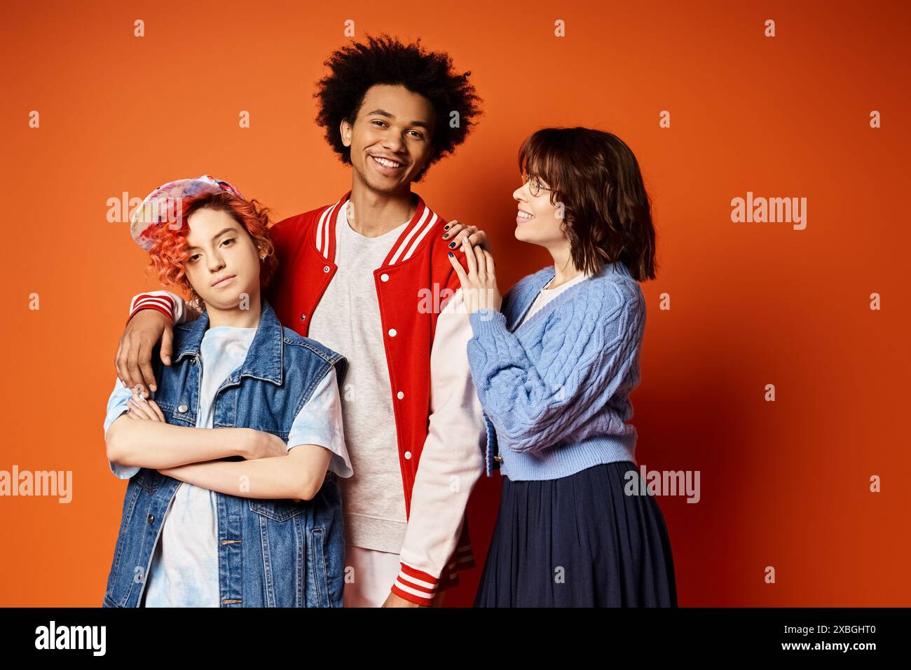 Multicultural friends, including nonbinary individual, standing ...