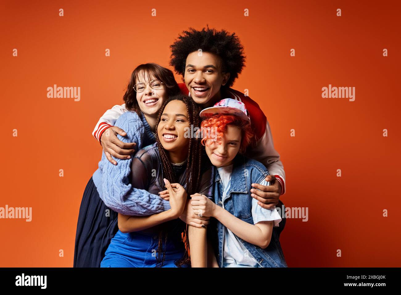 Multicultural young friends, including a nonbinary individual, dressed ...