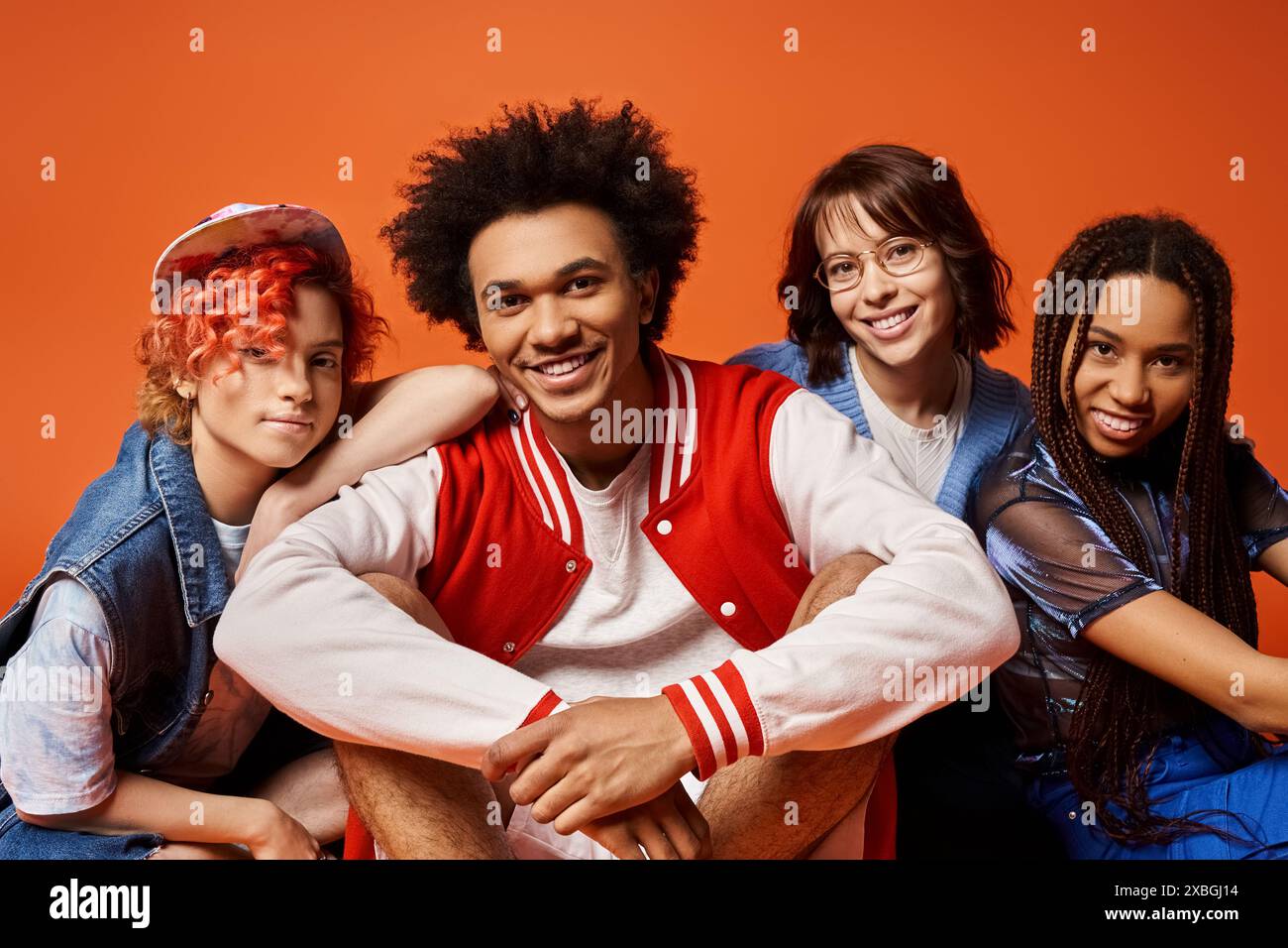 A group of young multicultural friends, including a nonbinary person ...