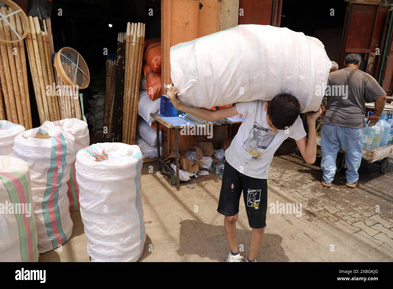 Baghdad, Iraq. 8th June, 2024. Abbas, 14, works in a carpentry workshop ...