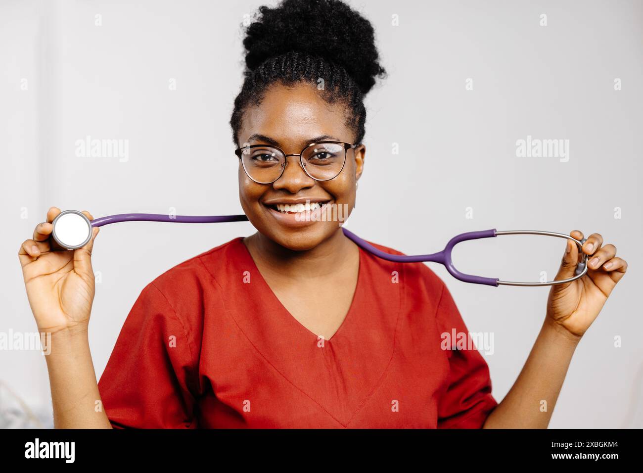 Female doctor red stethoscope in hi-res stock photography and images ...