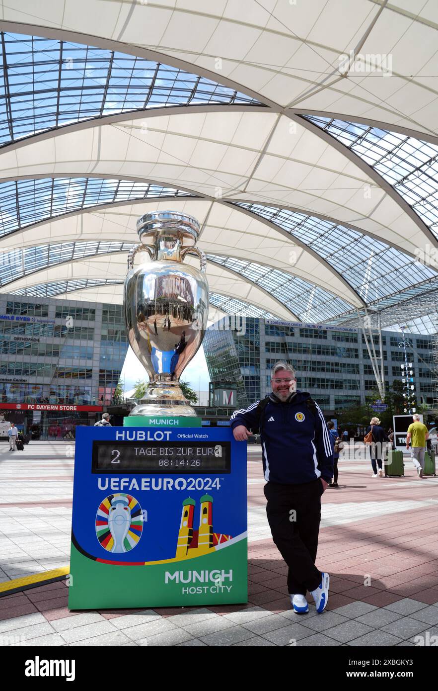 A Scotland fans next to giant trophy outside Munich Airport. Germany ...
