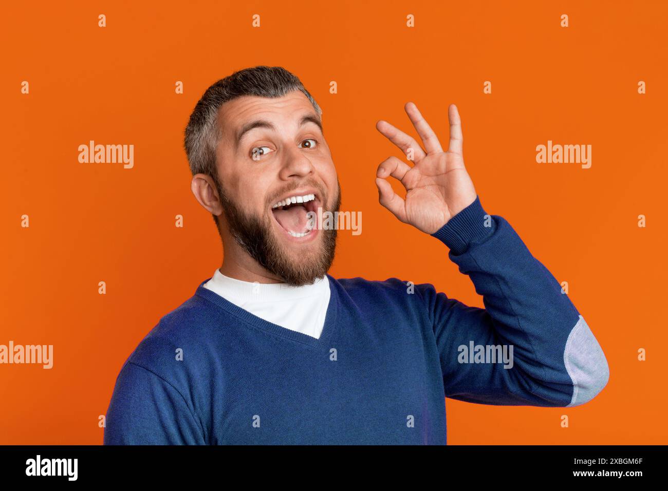 Man Making Funny Face With Hands, Orange Background Stock Photo - Alamy