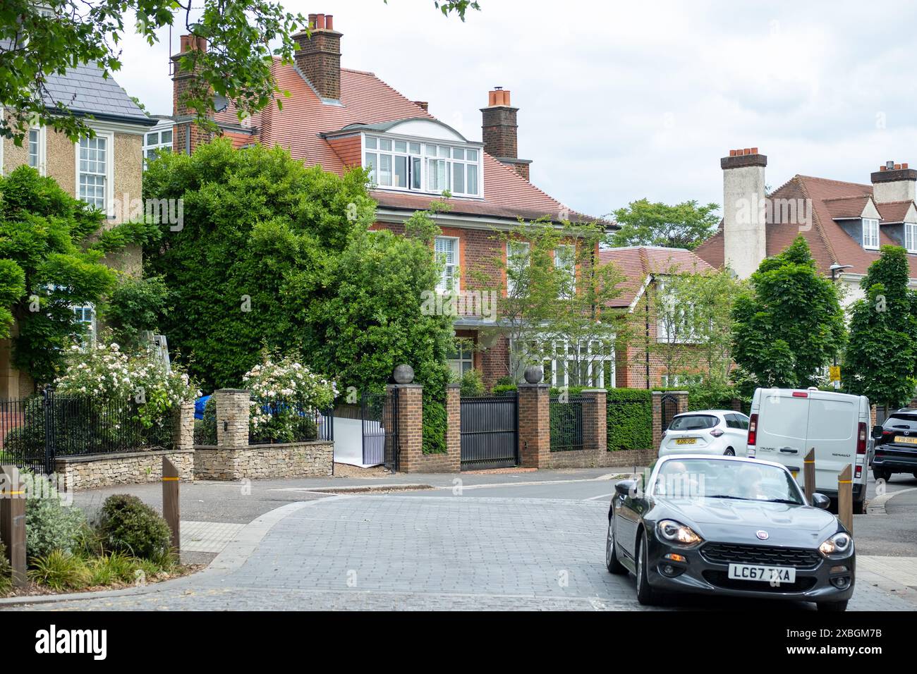 LONDON- JUNE 3, 2024: Street of upmarket large houses near Wimbledon ...
