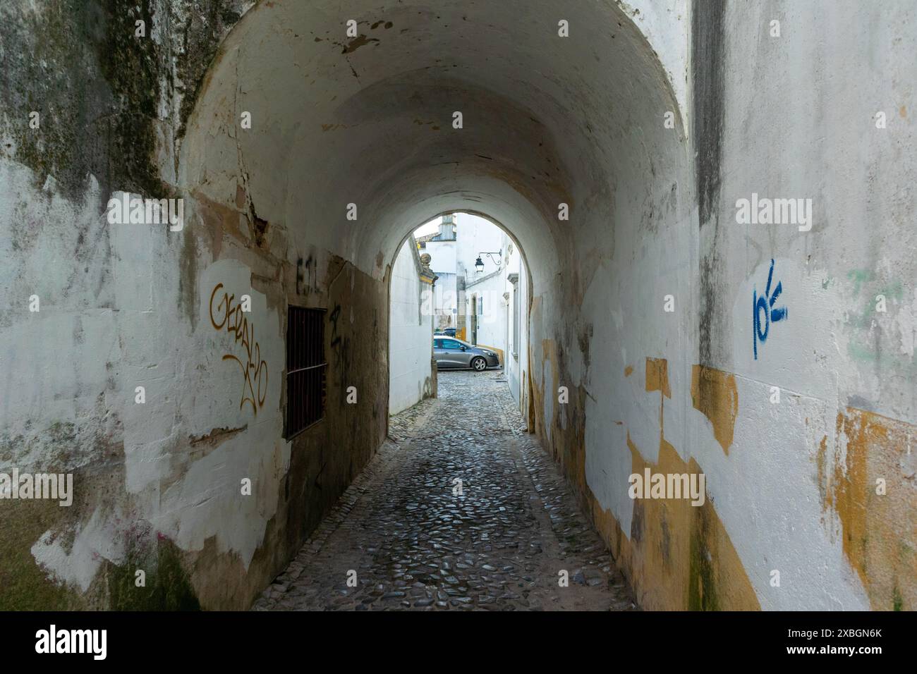 View of a path with an archway Stock Photo - Alamy