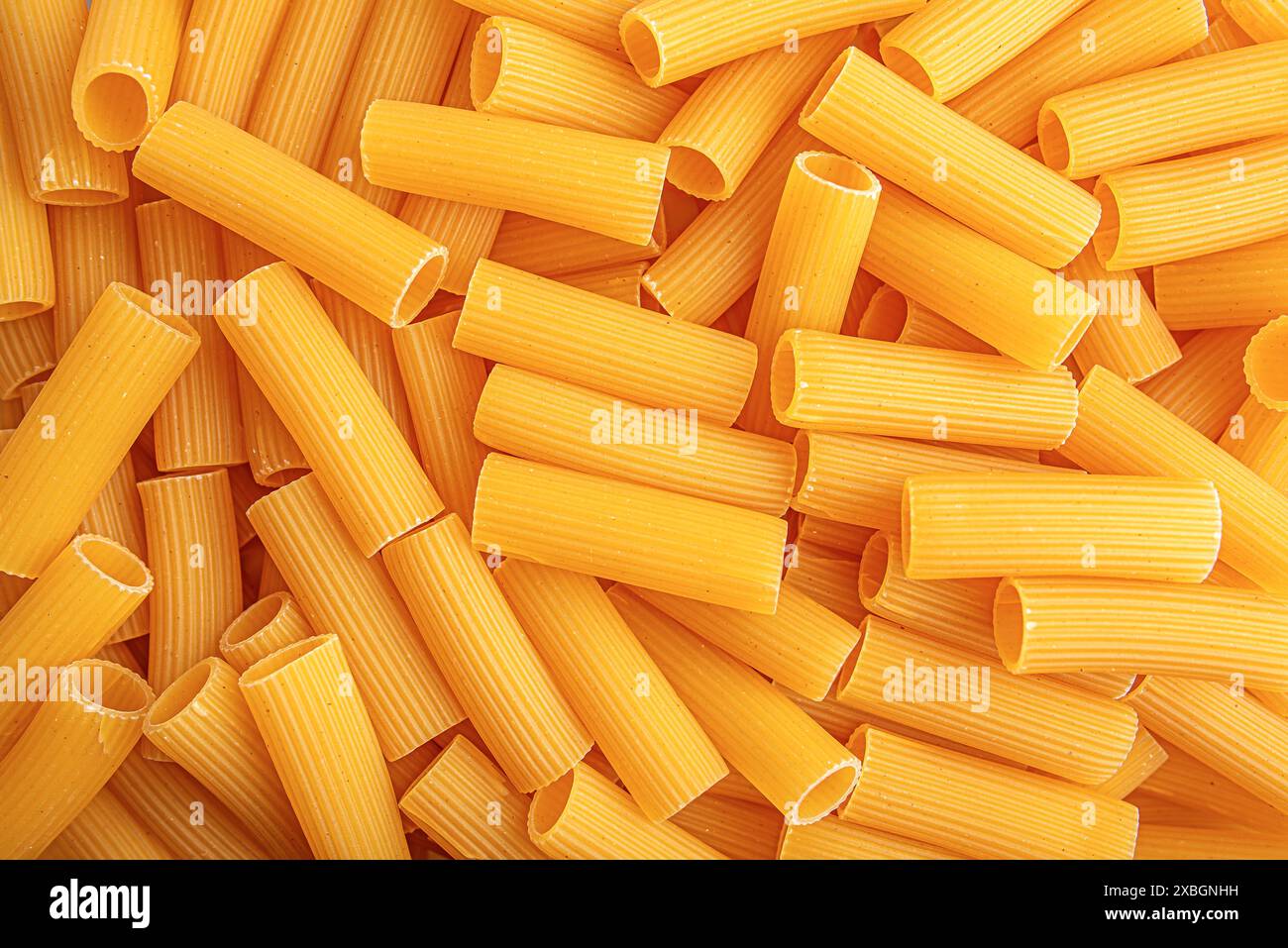 Yellow pasta background Stock Photo - Alamy
