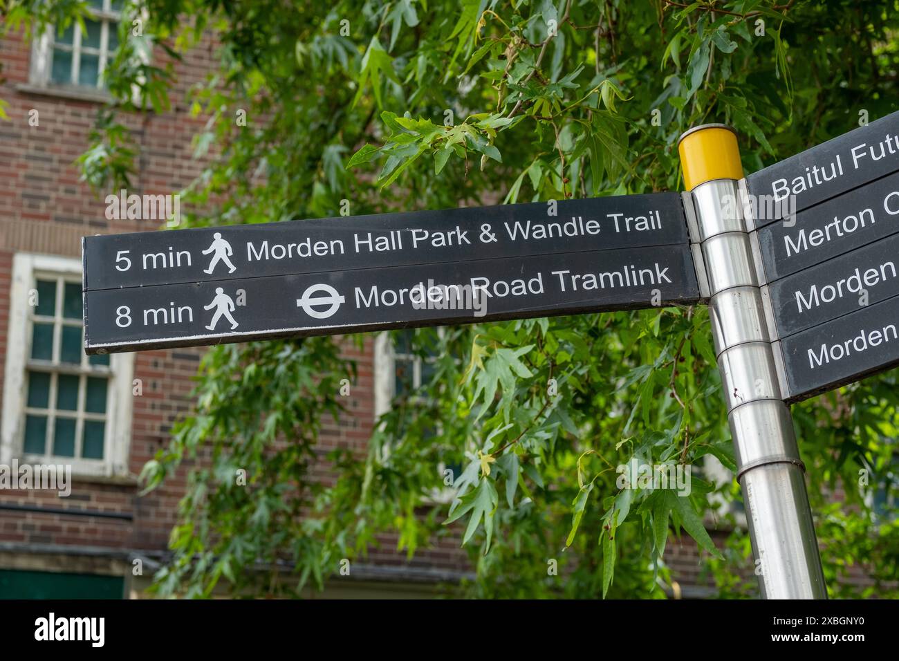 LONDON- JUNE 10, 2024: Pedestrian direction street sign for Morden Hall ...