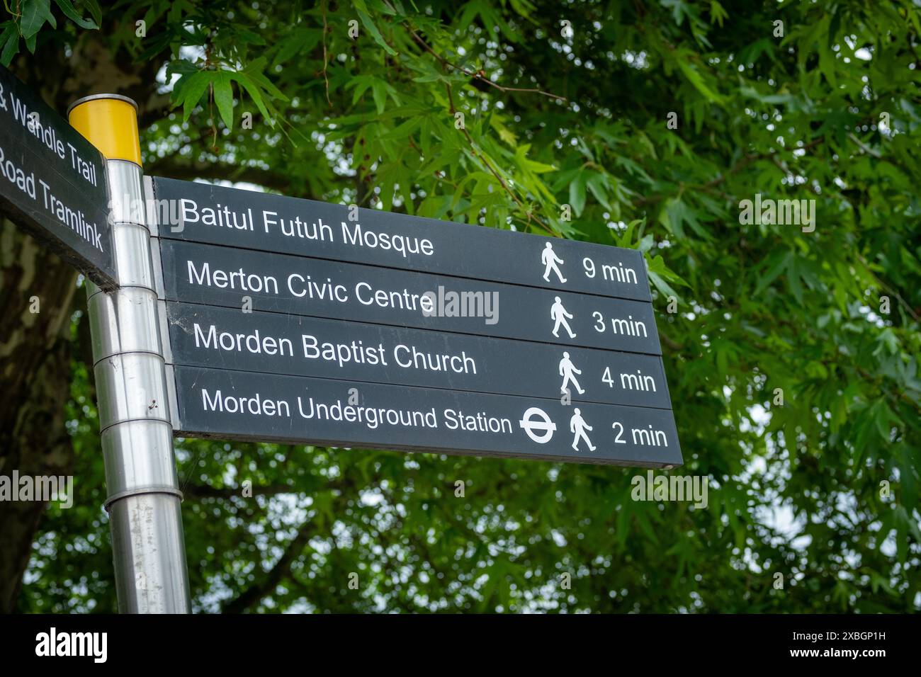 LONDON- JUNE 10, 2024: Pedestrian direction street sign for Baitul ...