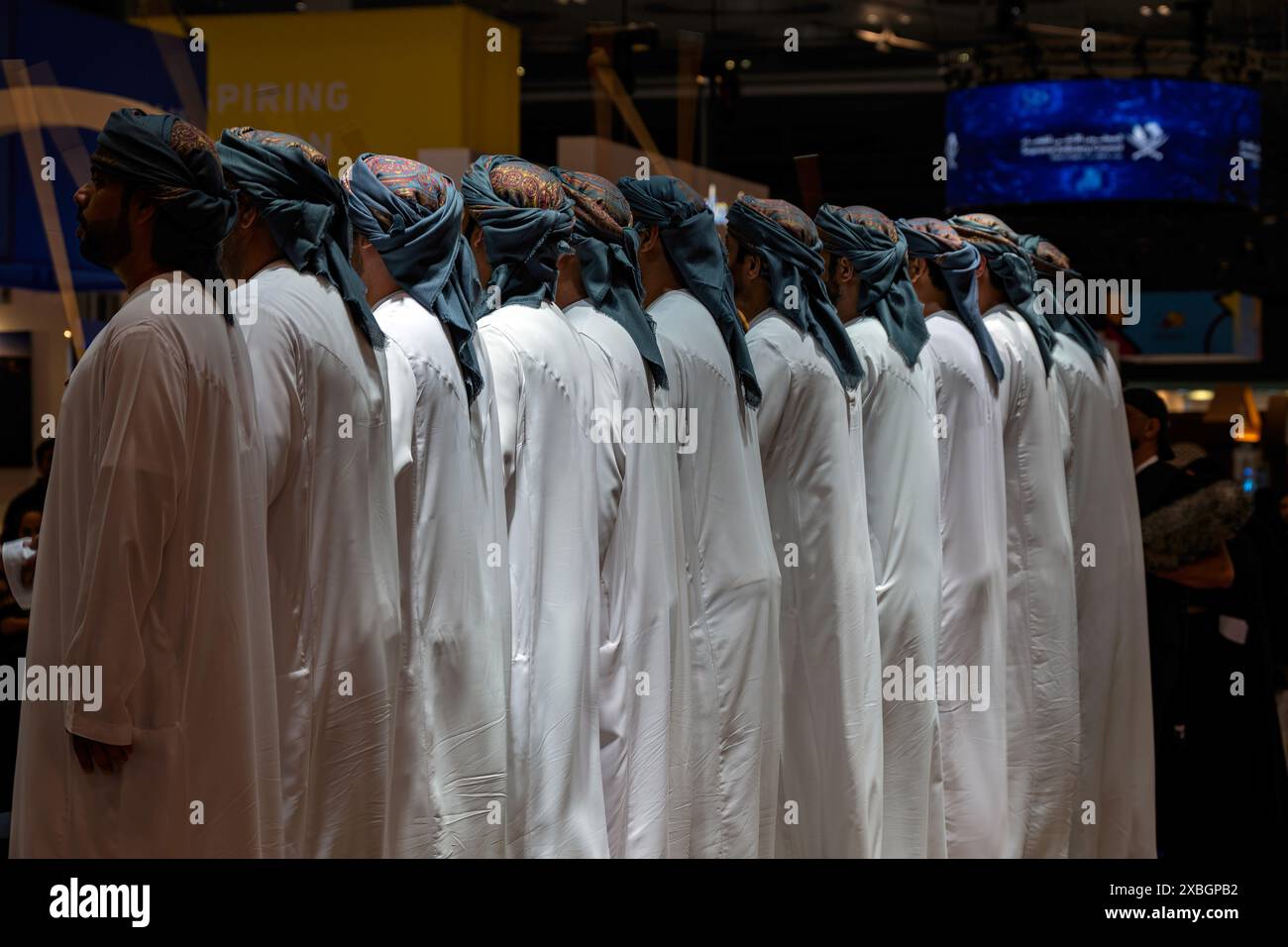 Omani men lined up for traditional singing and dancing in DECC Qatar ...