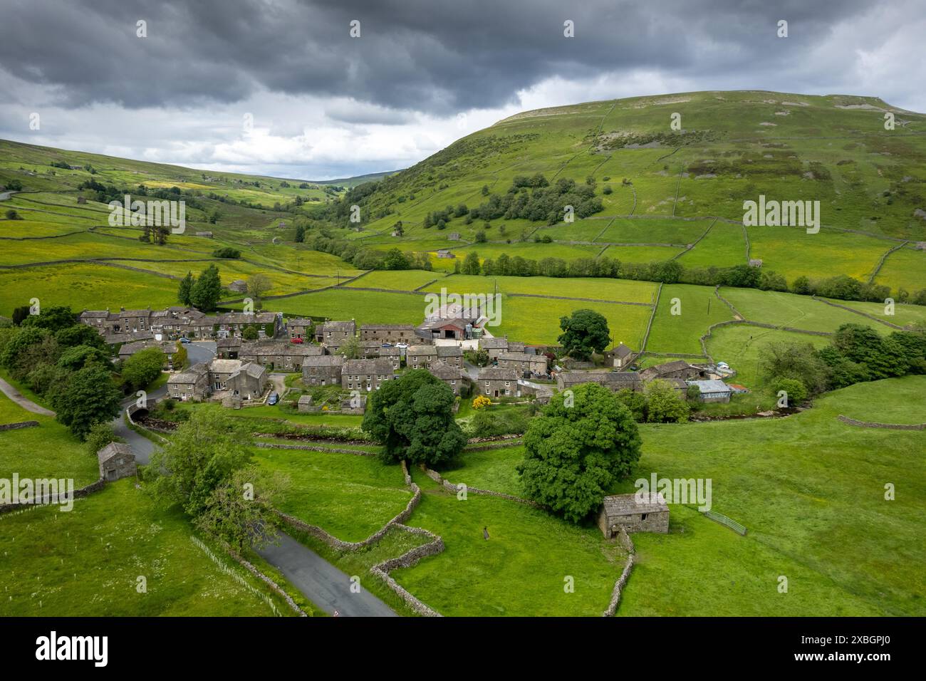 Hamlet of Thwaite near the head of Swaledale, in early summer, with ...