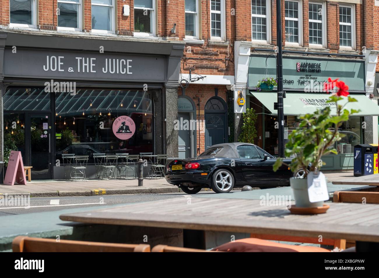 LONDON- JUNE 11, 2024: Wimbledon Village High Street shops. Retail ...