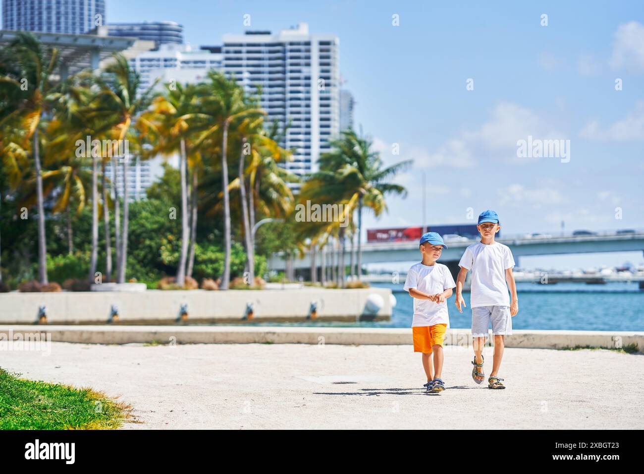 Picture from Miami of brothers walking on bay side Stock Photo - Alamy
