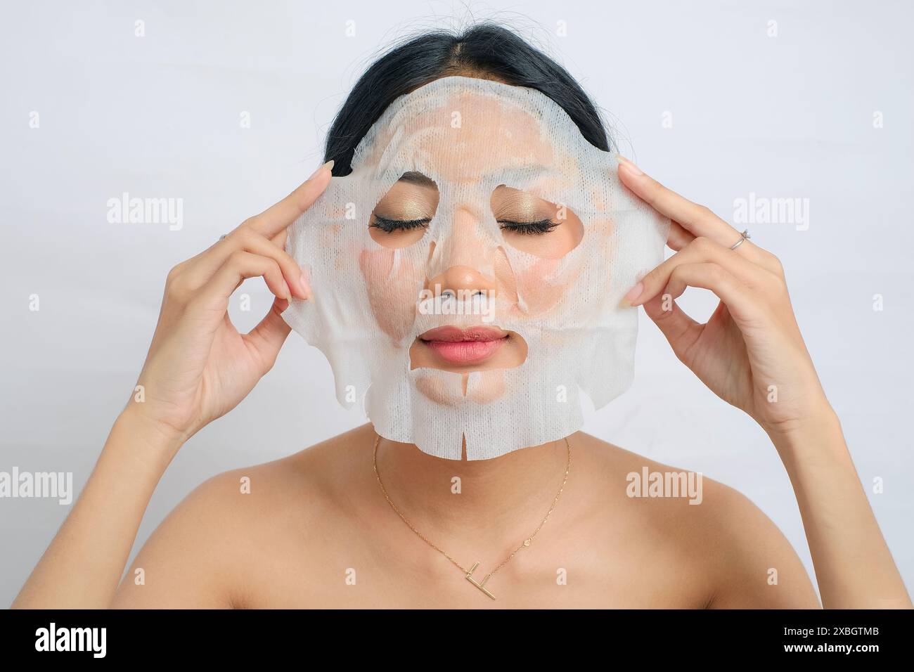 Close up Asian Woman with Smooth Skin Wearing Facial Mask on White ...