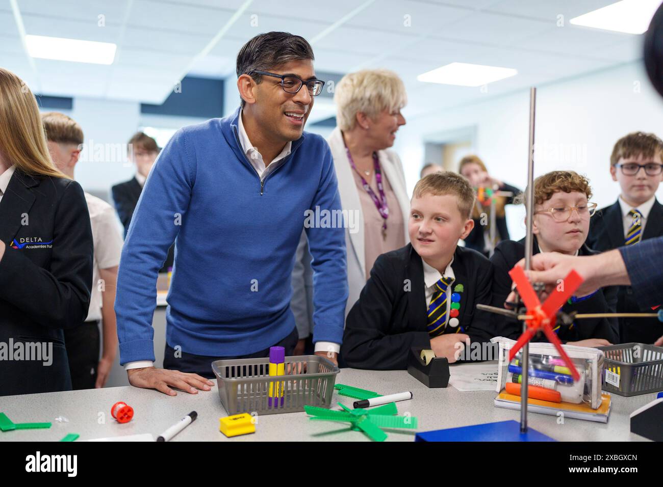 Prime Minister Rishi Sunak speaks pupils in a science lesson during a ...