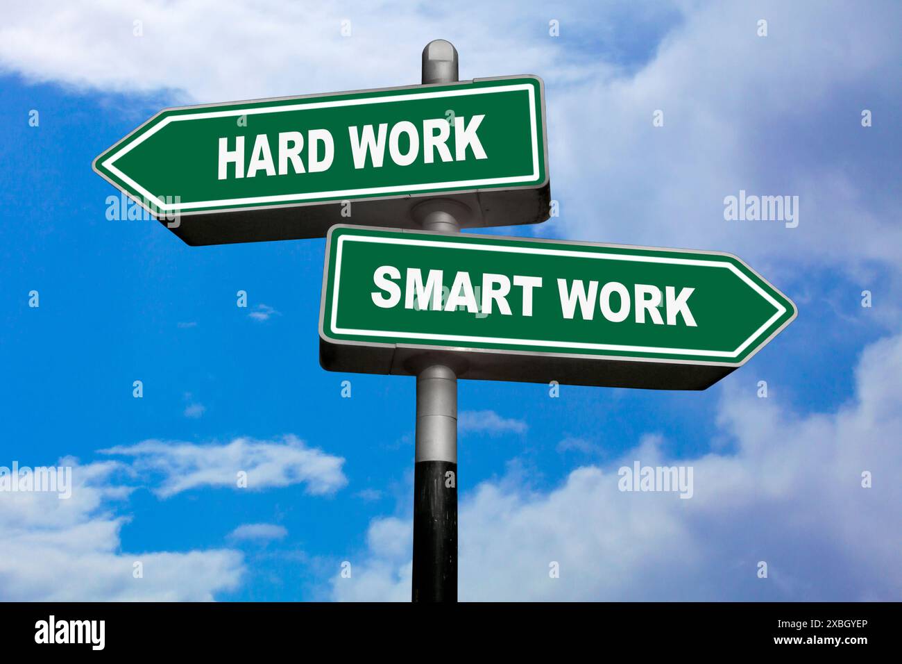 Two direction signs, one pointing left (Hard work), and the other one ...