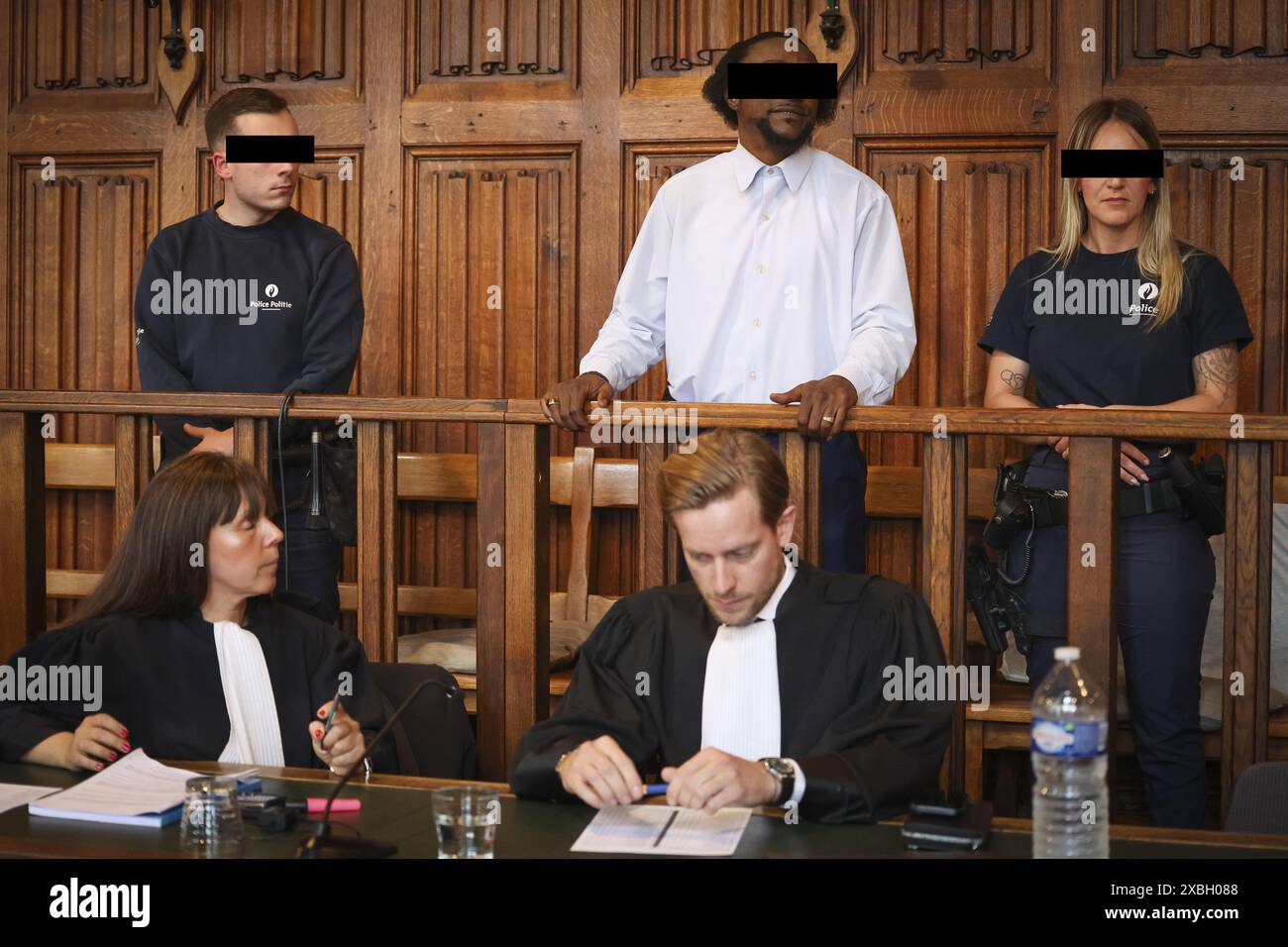 The accused Fabrice Luaza Mvuama and lawyers Severine Solfrini and ...