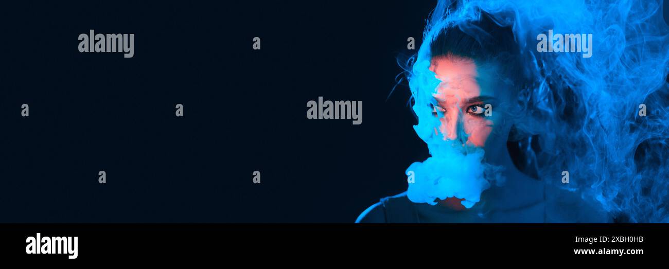 Woman Surrounded by Blue Smoke in Dim Lighting During Nighttime Stock ...