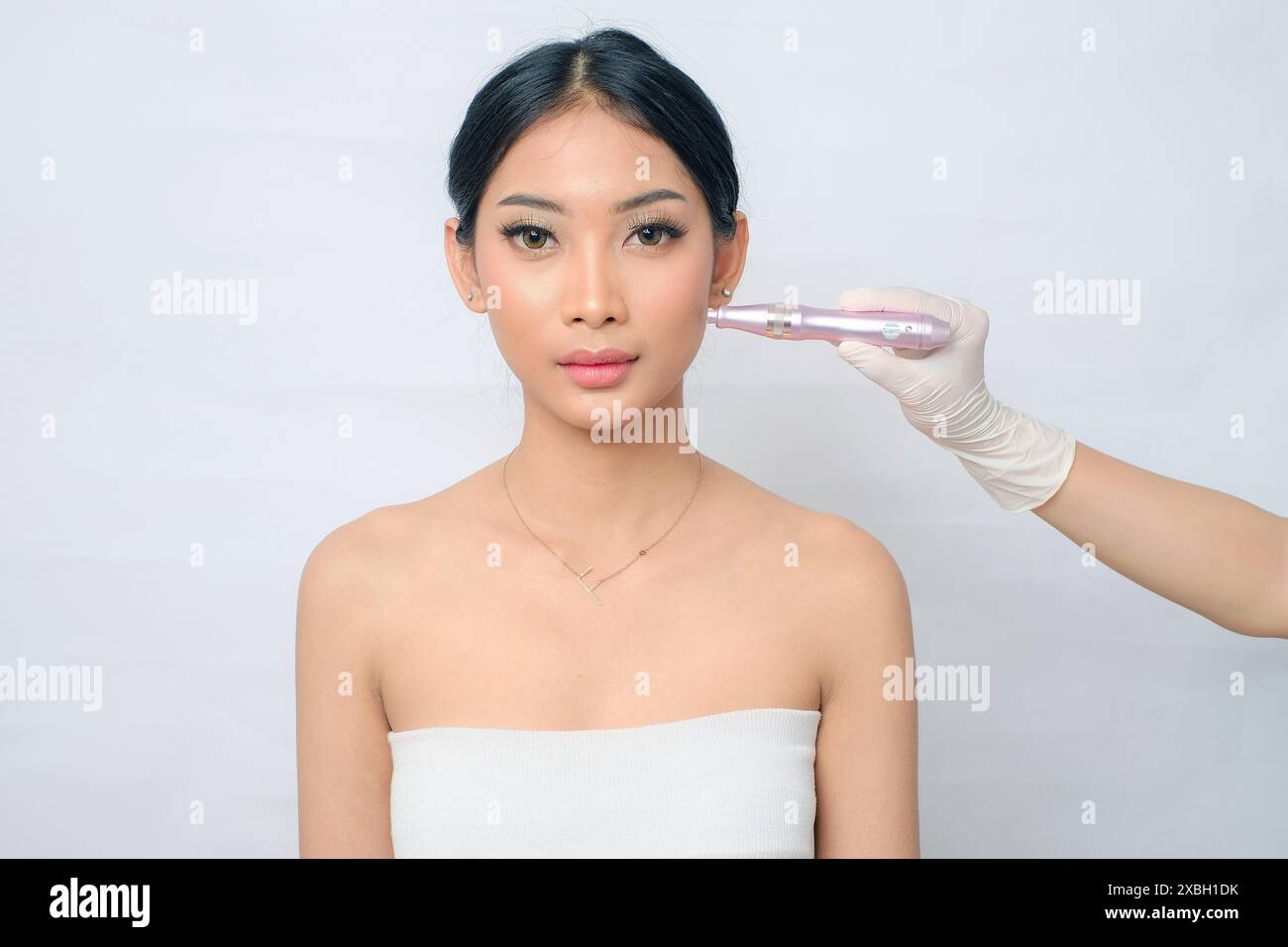 Lovely Asian Woman Using Dermatology Pen for Facial Treatment at Home ...