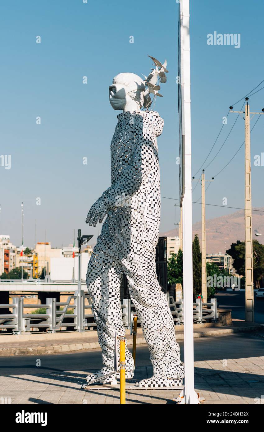 Metal sculpture of a man in Shiraz, Iran Stock Photo - Alamy