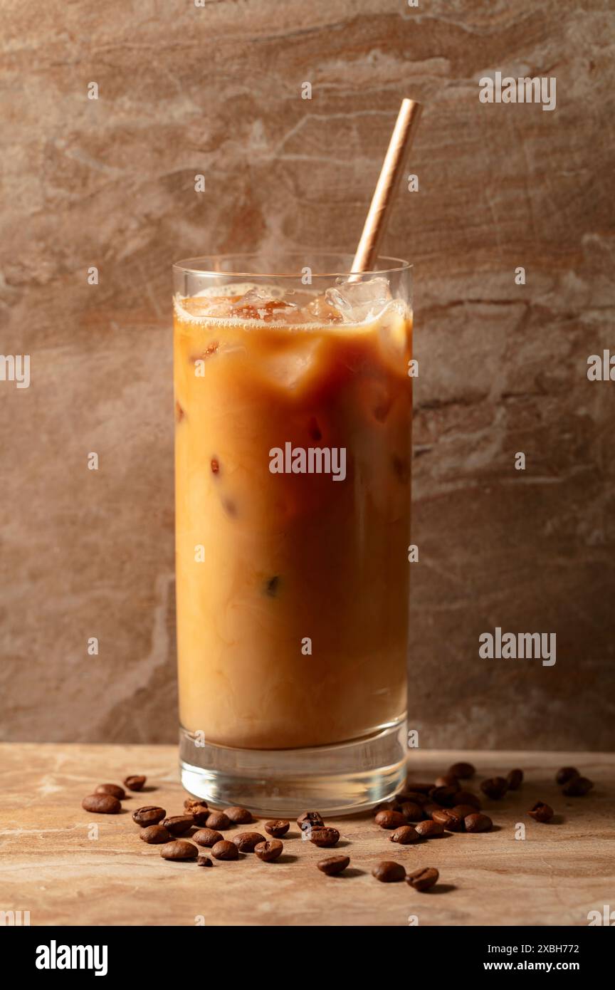 Iced coffee with cream, refreshing and sweet coffee drink on a beige ...