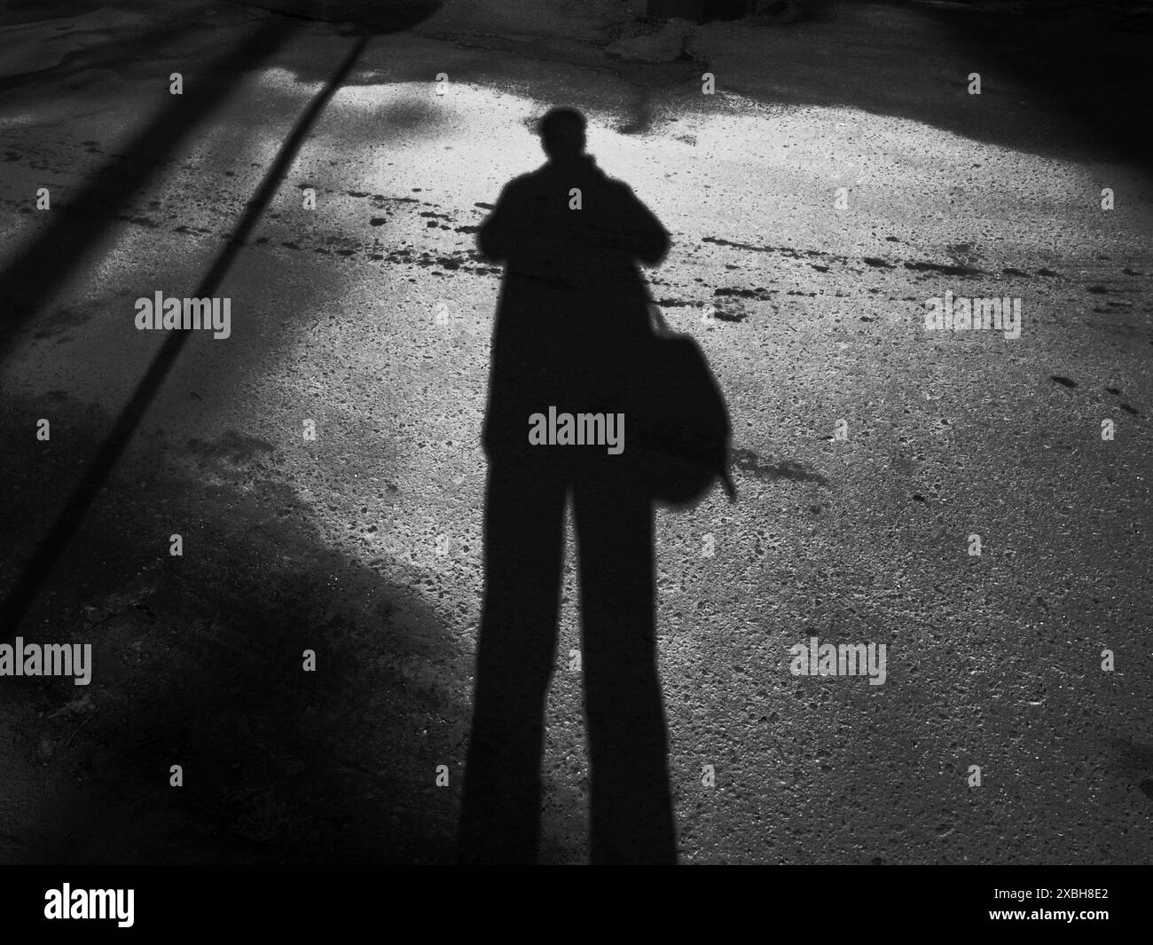 shadow from the man on the road Stock Photo - Alamy