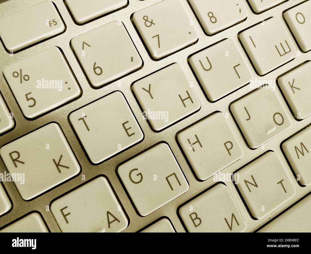 white keyboard against a window Stock Photo - Alamy