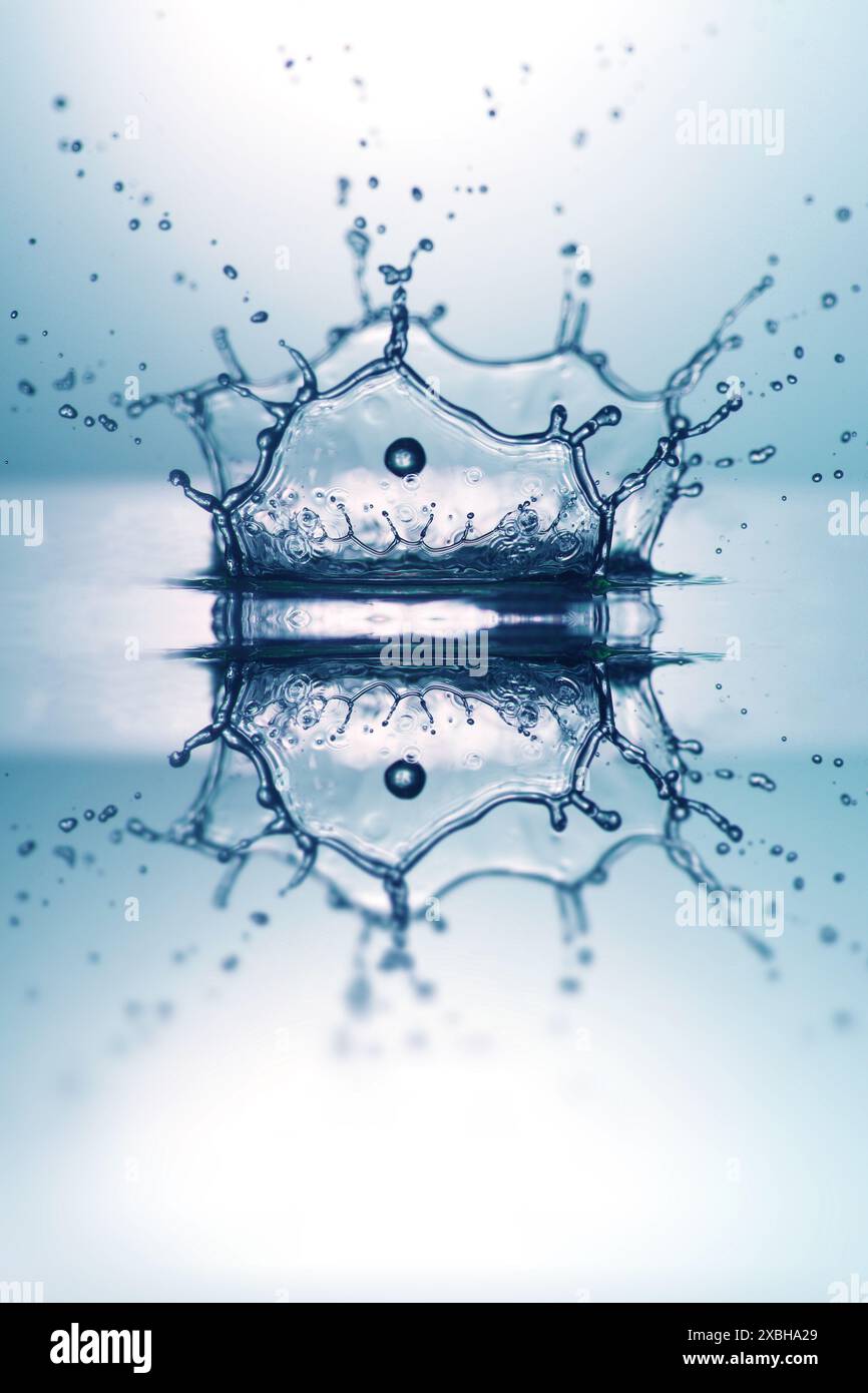 water drop falling in water Stock Photo - Alamy