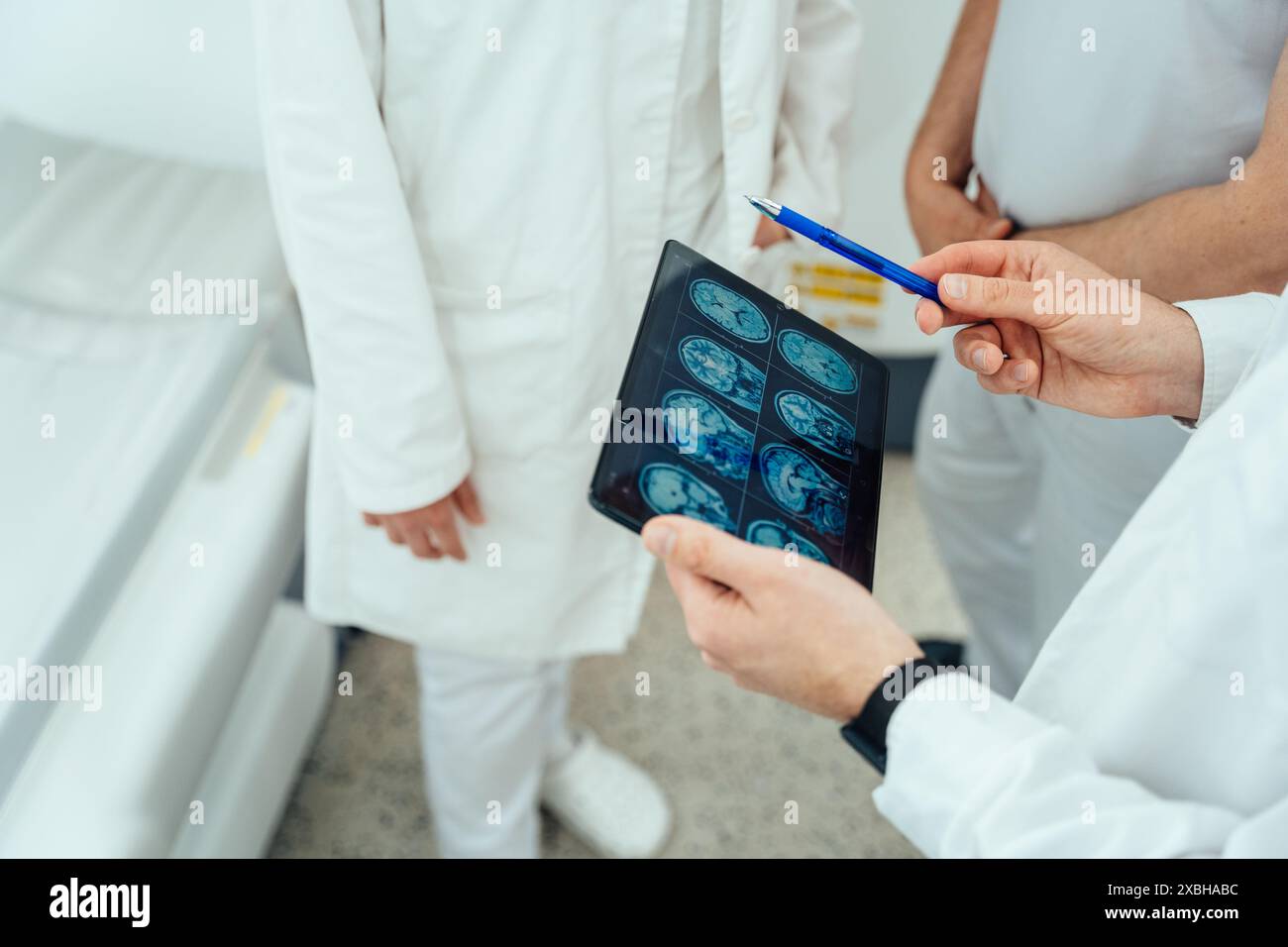A doctor is showing a patient a CT scan of their head Stock Photo - Alamy