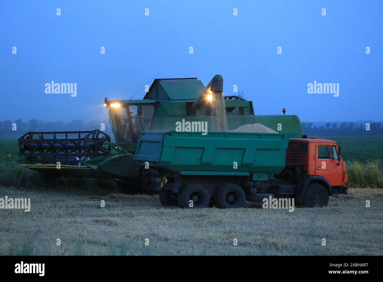 Combine harvester working night hi-res stock photography and images - Alamy