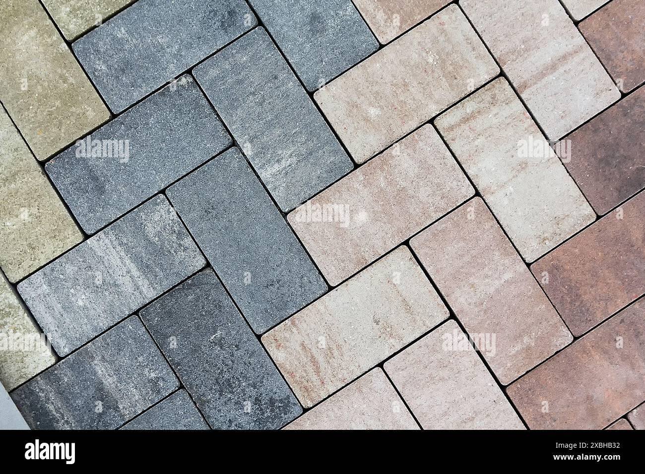 Multicolored paving slabs for road paving by mosaic on shop window ...