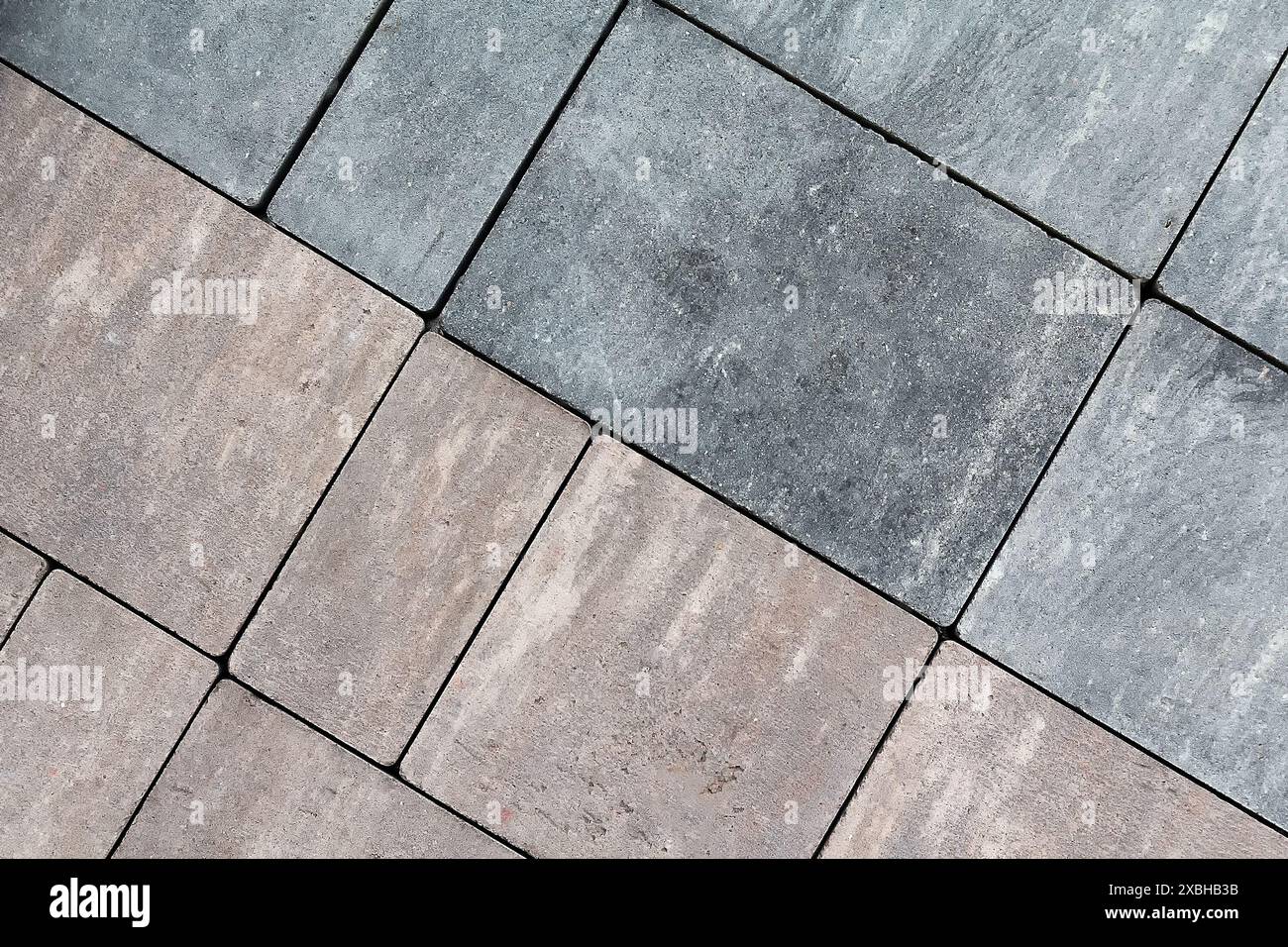 Multicolored paving slabs for road paving by mosaic on shop window ...