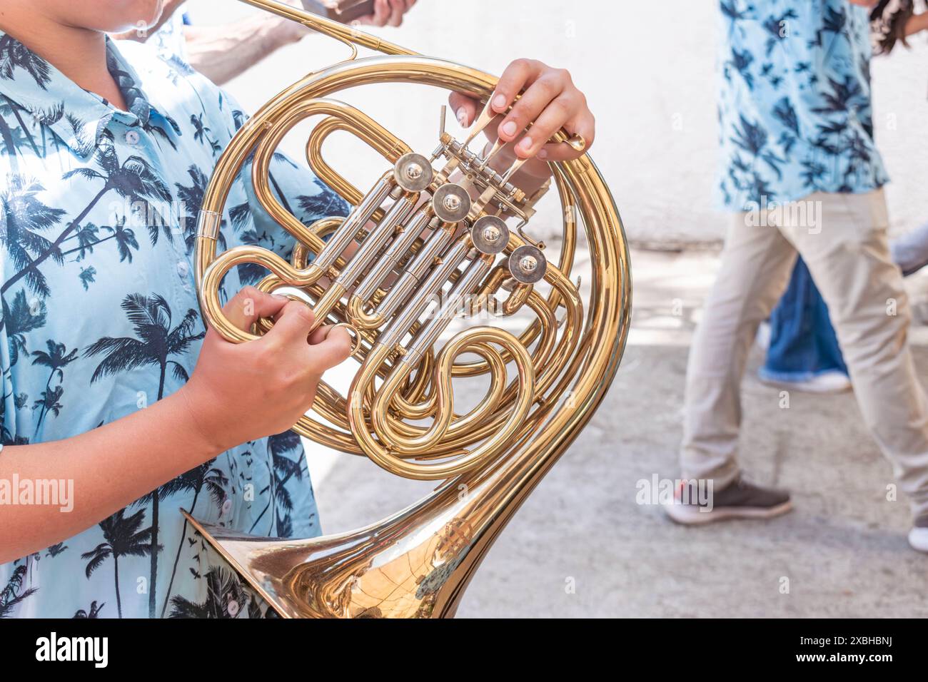 close-up of a horn which is played by a young man on the streets of a ...