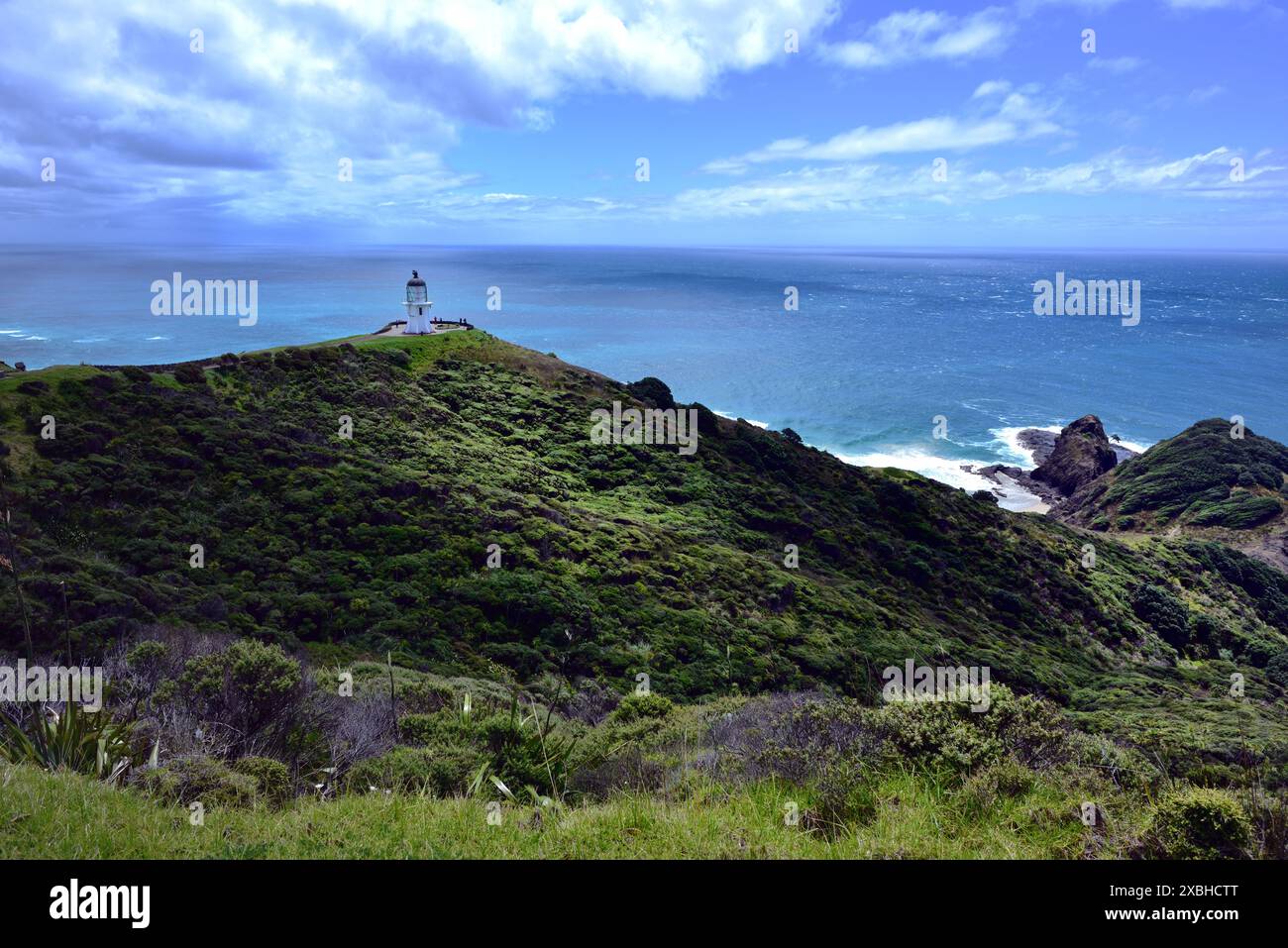 Seas meet and the lighthouse of Cape Reinga, New Zealand Stock Photo ...