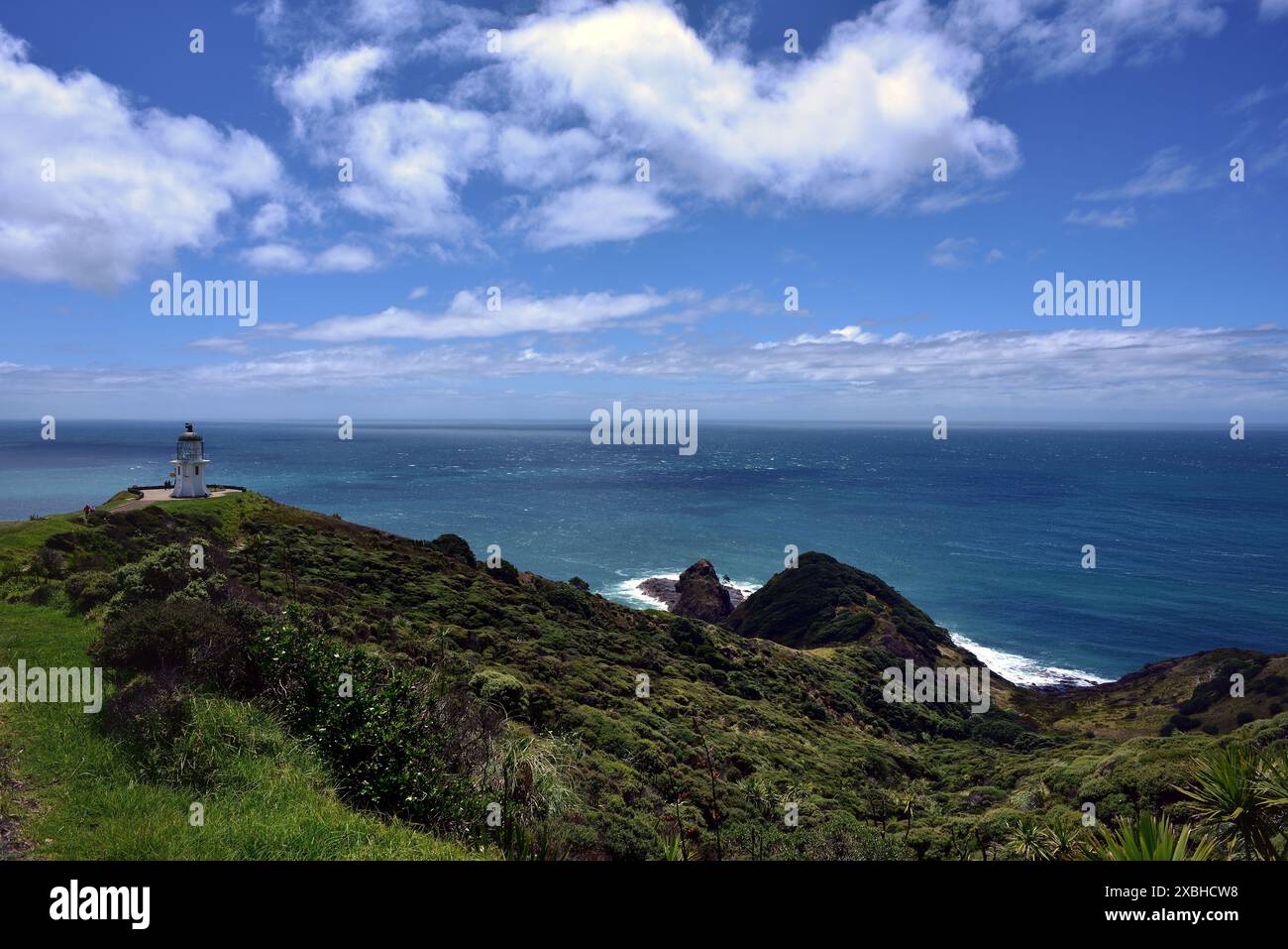 Seas meet and the lighthouse of Cape Reinga, New Zealand Stock Photo ...