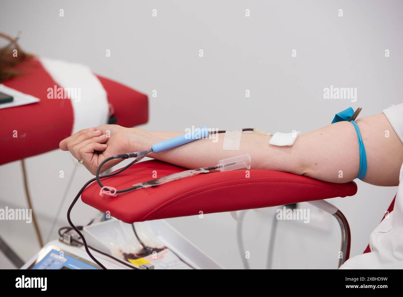 view of donor giving blood at donation center Stock Photo - Alamy