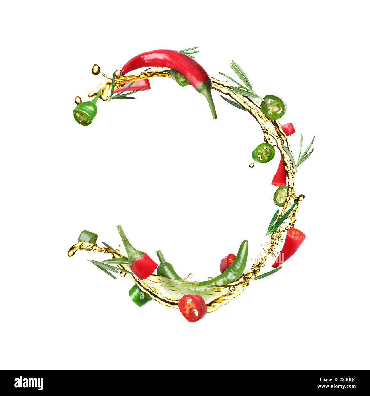 Cooking oil splash with chili peppers and rosemary in air on white ...