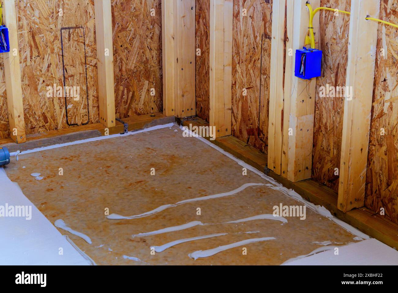 Installation of expanded polystyrene in room for floor thermal ...