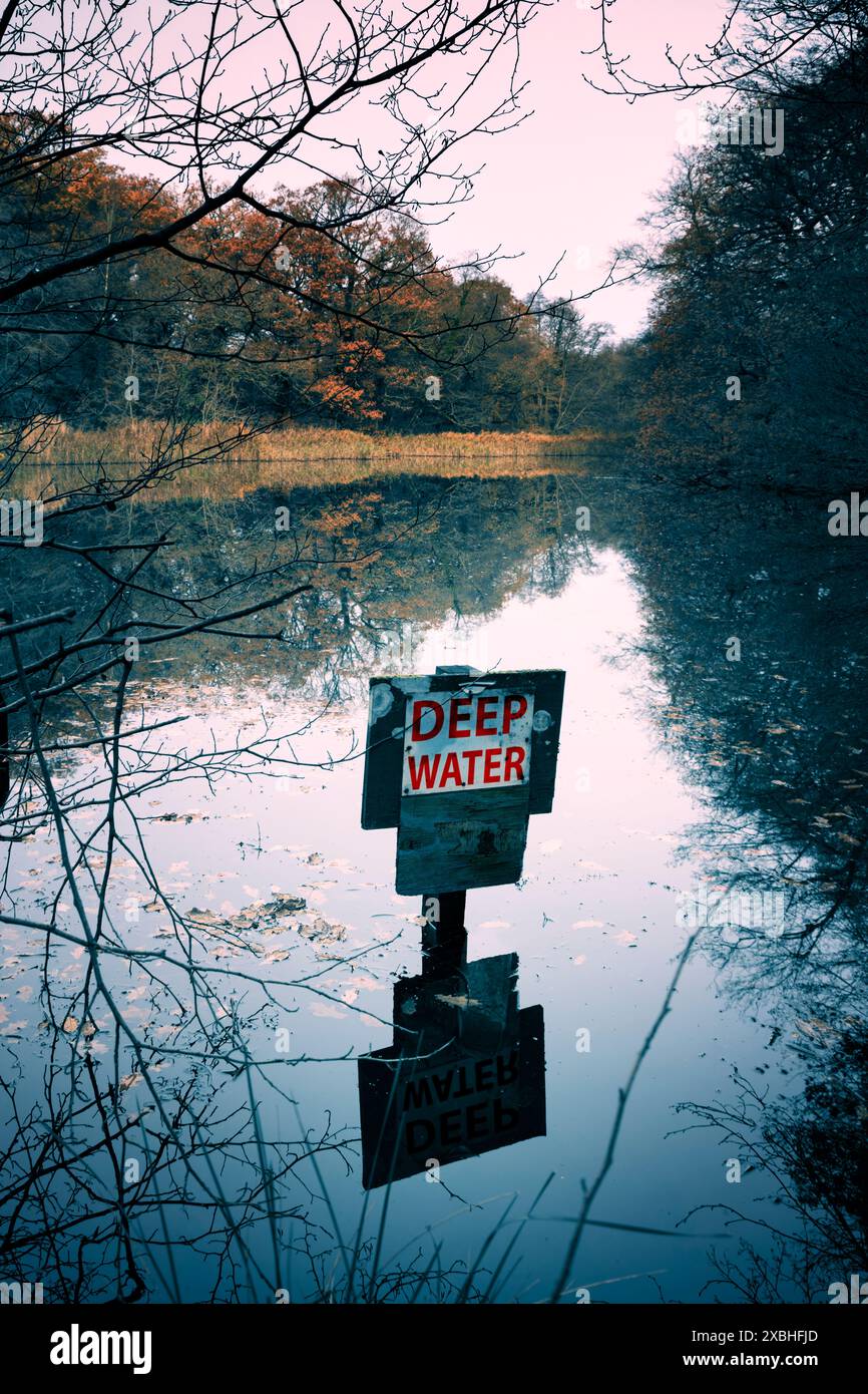 Deep water sign in a woodland lake Stock Photo - Alamy