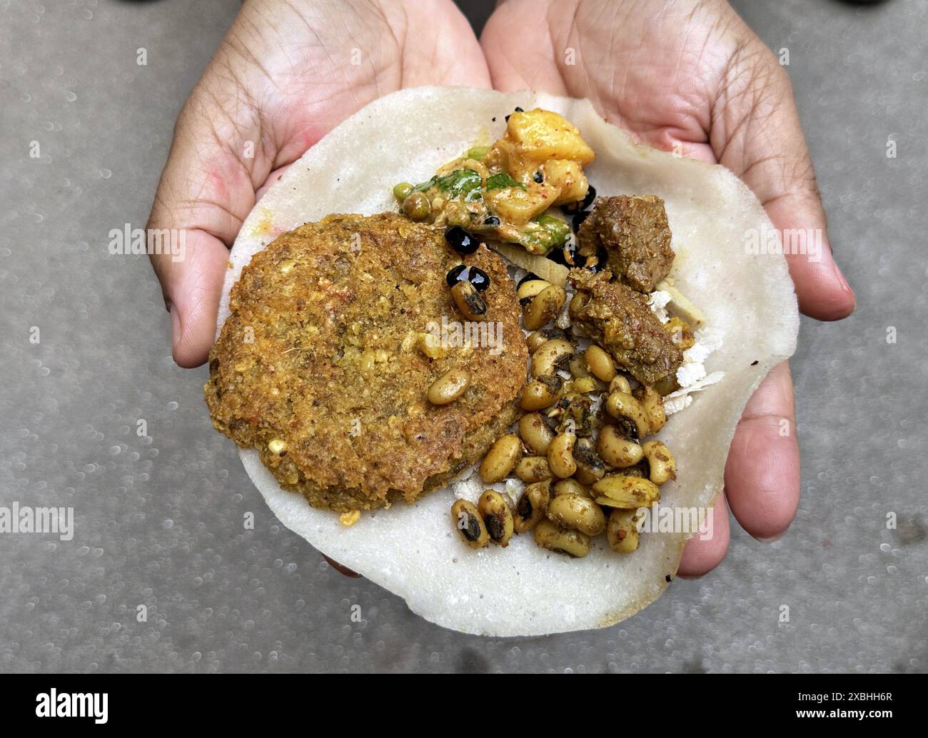 June 12, 2024: A man from the Newar community receives offerings after ...