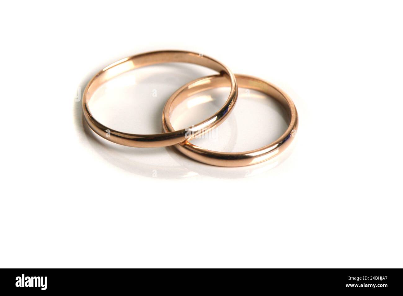Wedding rings on a white background Stock Photo - Alamy